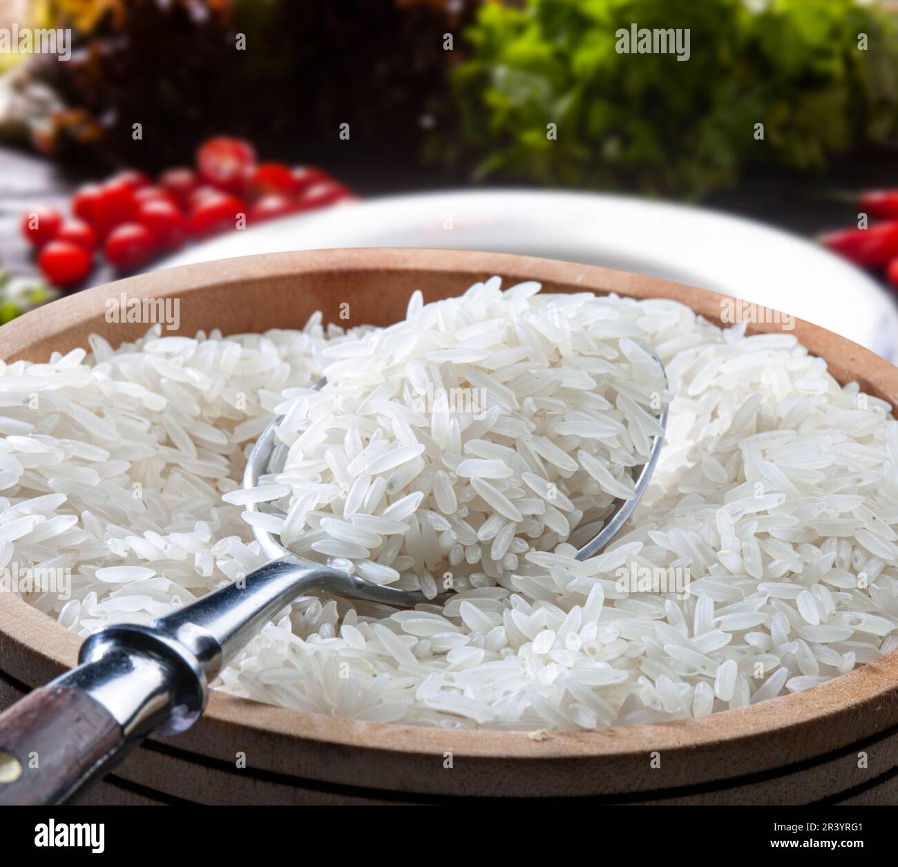 Spoonful of raw rice Stock Photo - Alamy