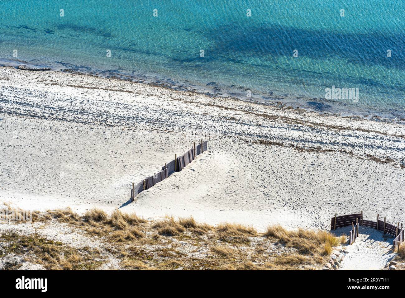 Sand fences on the southern beach of Fehmarn Stock Photo - Alamy