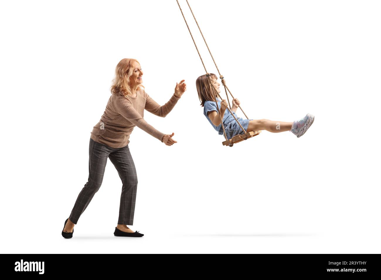 Woman pushing a little girl on a swing isolated on white background ...
