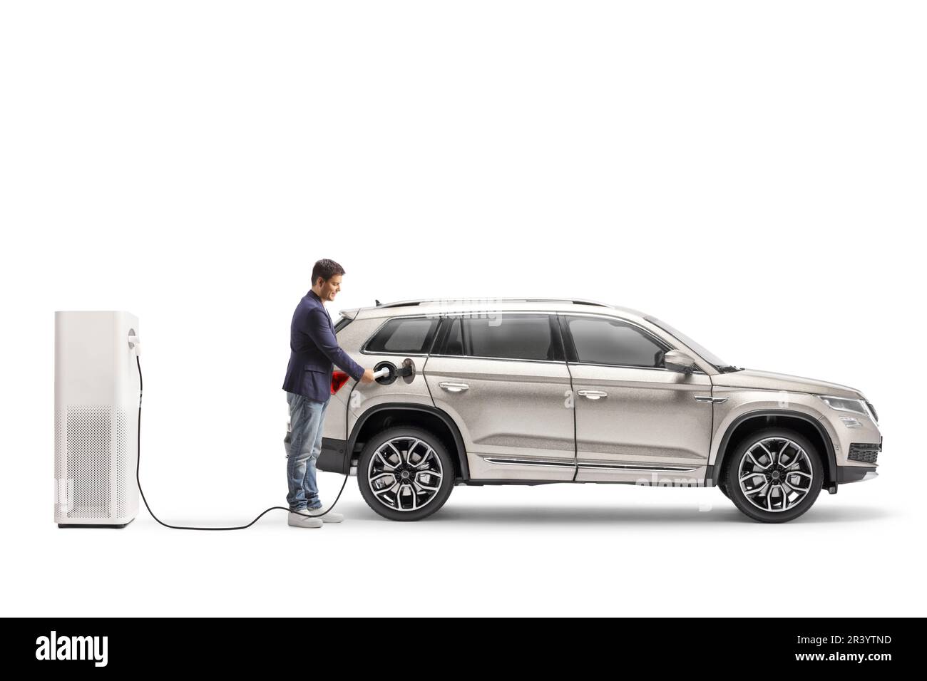 Full length shot of a man charging a SUV from an electric vehicle ...