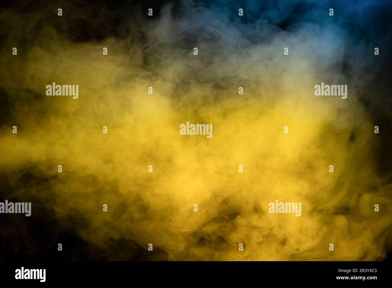 Blue and yellow steam on a black background. Copy space Stock Photo - Alamy
