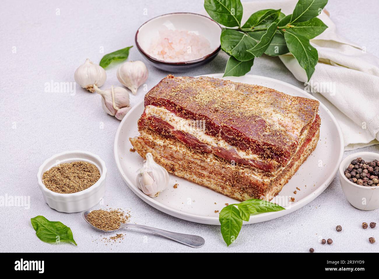 Piece of salty high-fat meat cooked with spices. Salo, bacon, lard ...
