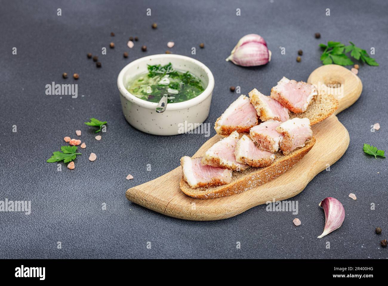 Canapes with rye bread and pieces of salty high-fat meat cooked with ...