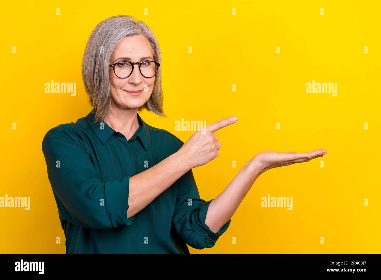 Portrait of elegant lady indicate finger hand hold empty space wear ...
