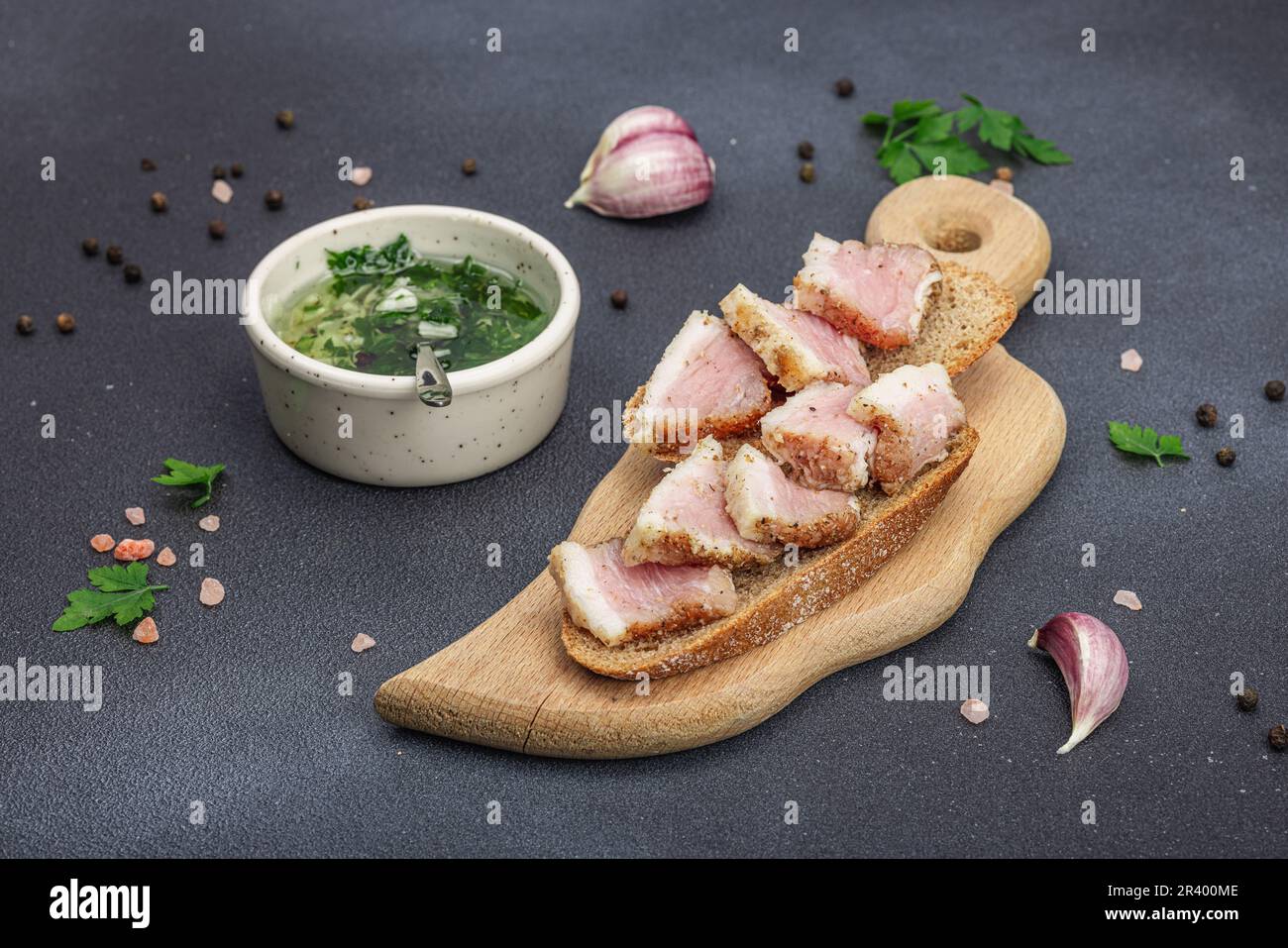 Canapes with rye bread and pieces of salty high-fat meat cooked with ...