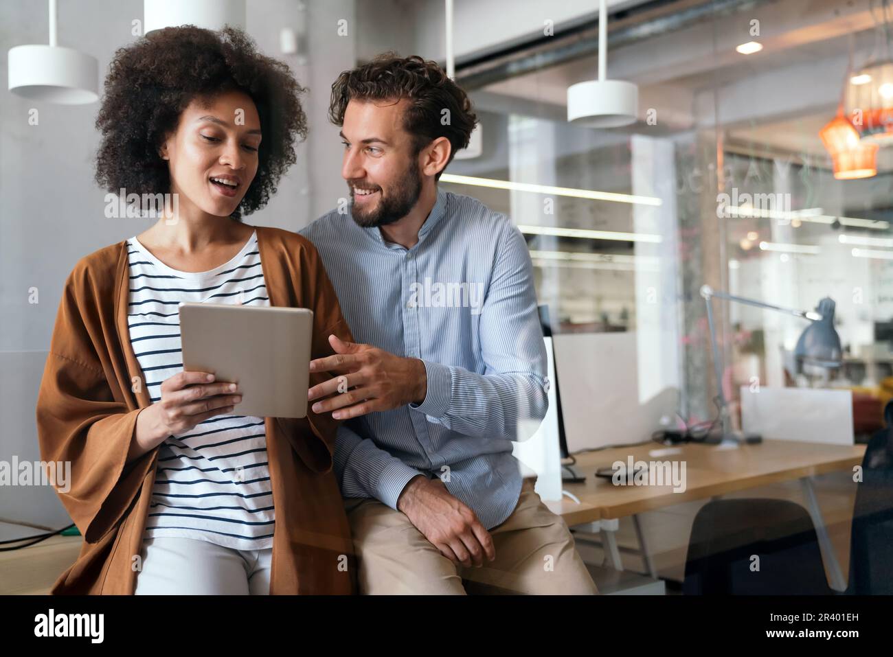 Successful business people, designer enjoying work together. Business ...