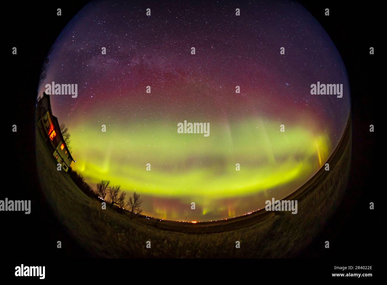 A G2 auroral storm with the auroral curtains exhibiting red tops from ...
