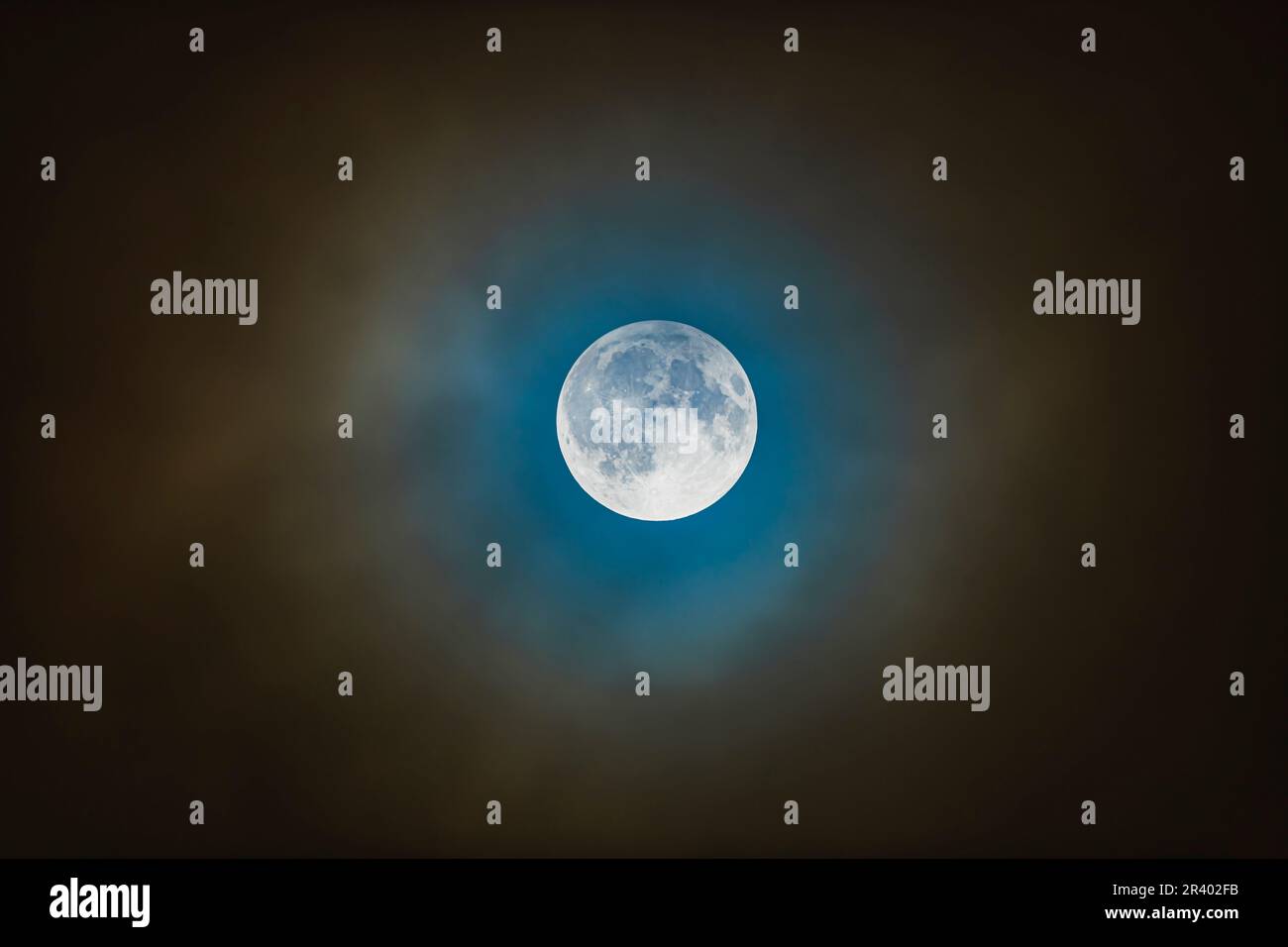 Penumbral lunar eclipse in clouds Stock Photo - Alamy