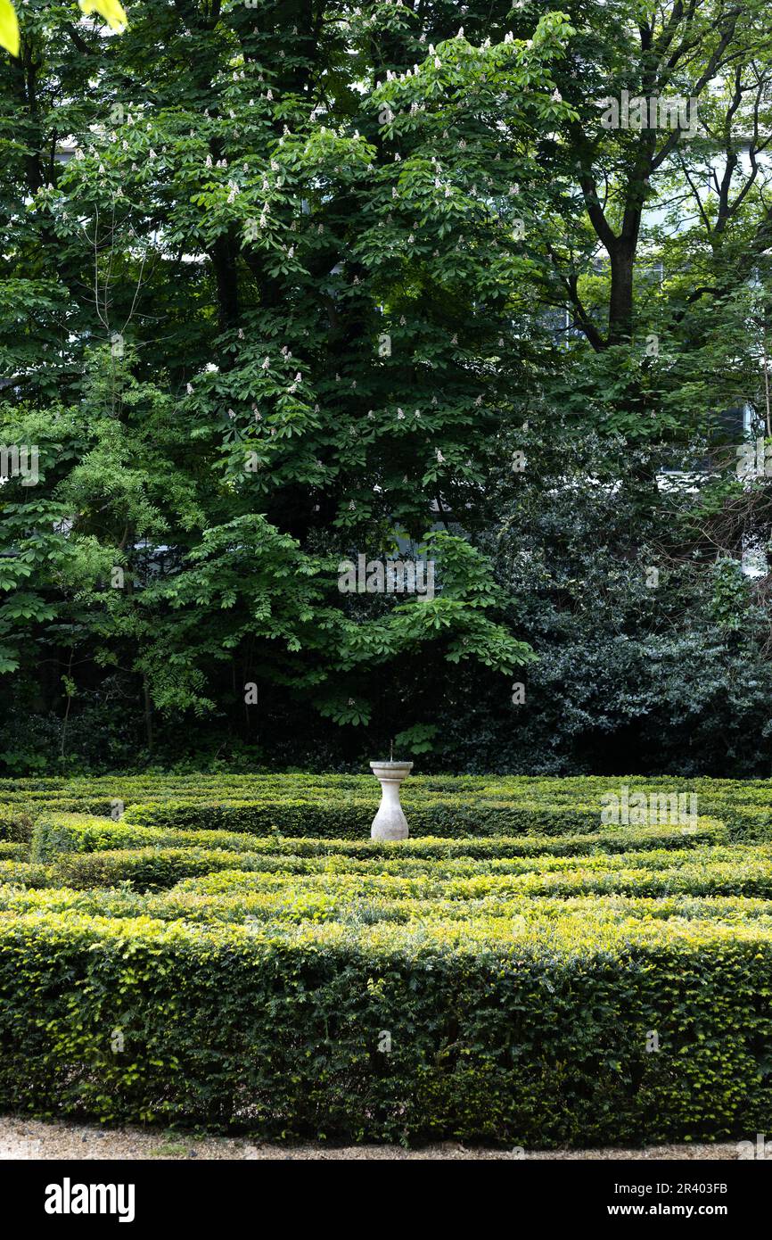 A sundial in the center of the yew maze, at Iveagh Gardens in Dublin ...