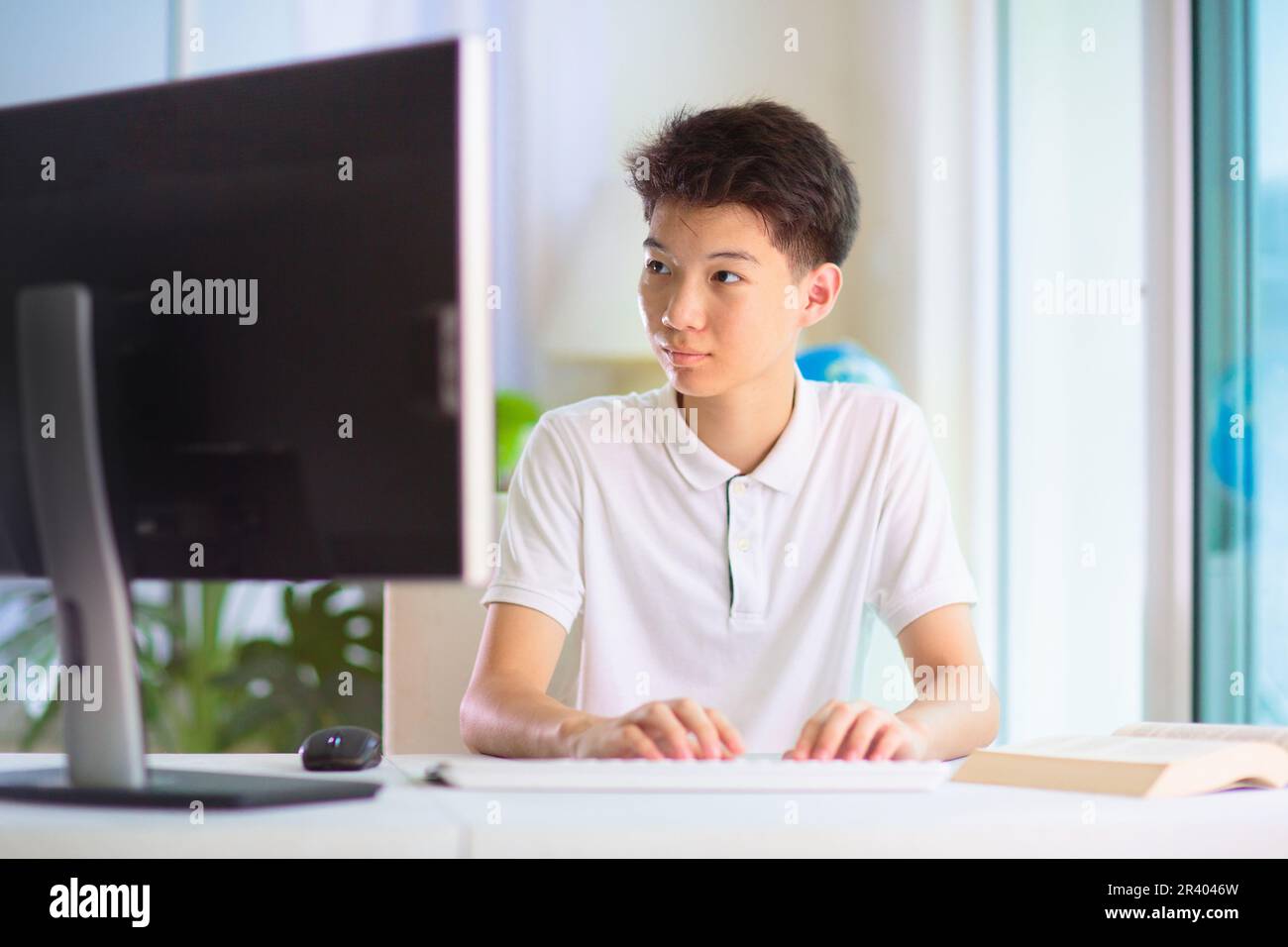 Child doing homework on computer. Online class. Homeschooling and ...