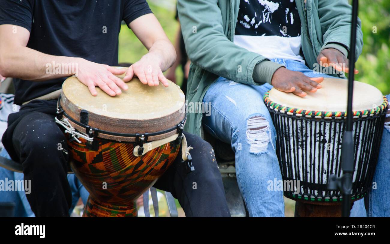 Drummer hands playing the ethnic djembe drum Stock Photo - Alamy