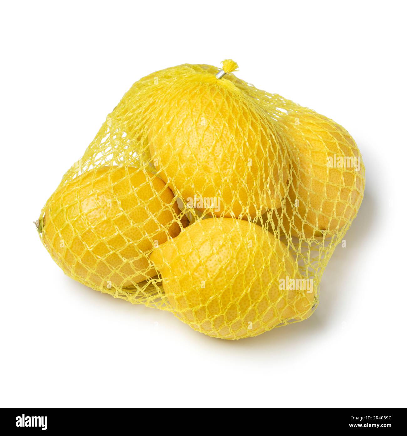 Yellow net with whole fresh lemons close up isolated on white ...