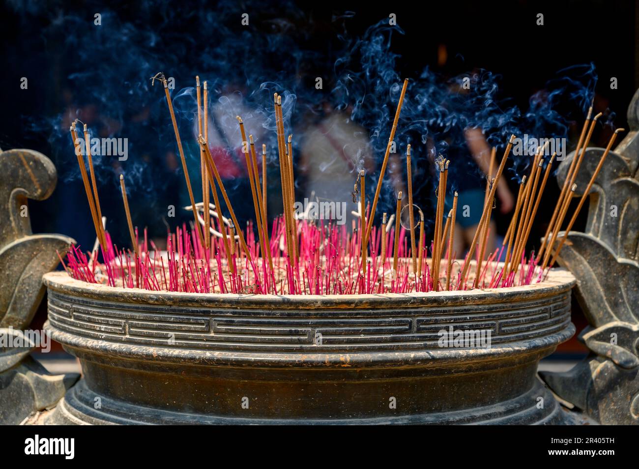Closeup of incense burner with burning sticks at the Thien Mu Pagoda in ...