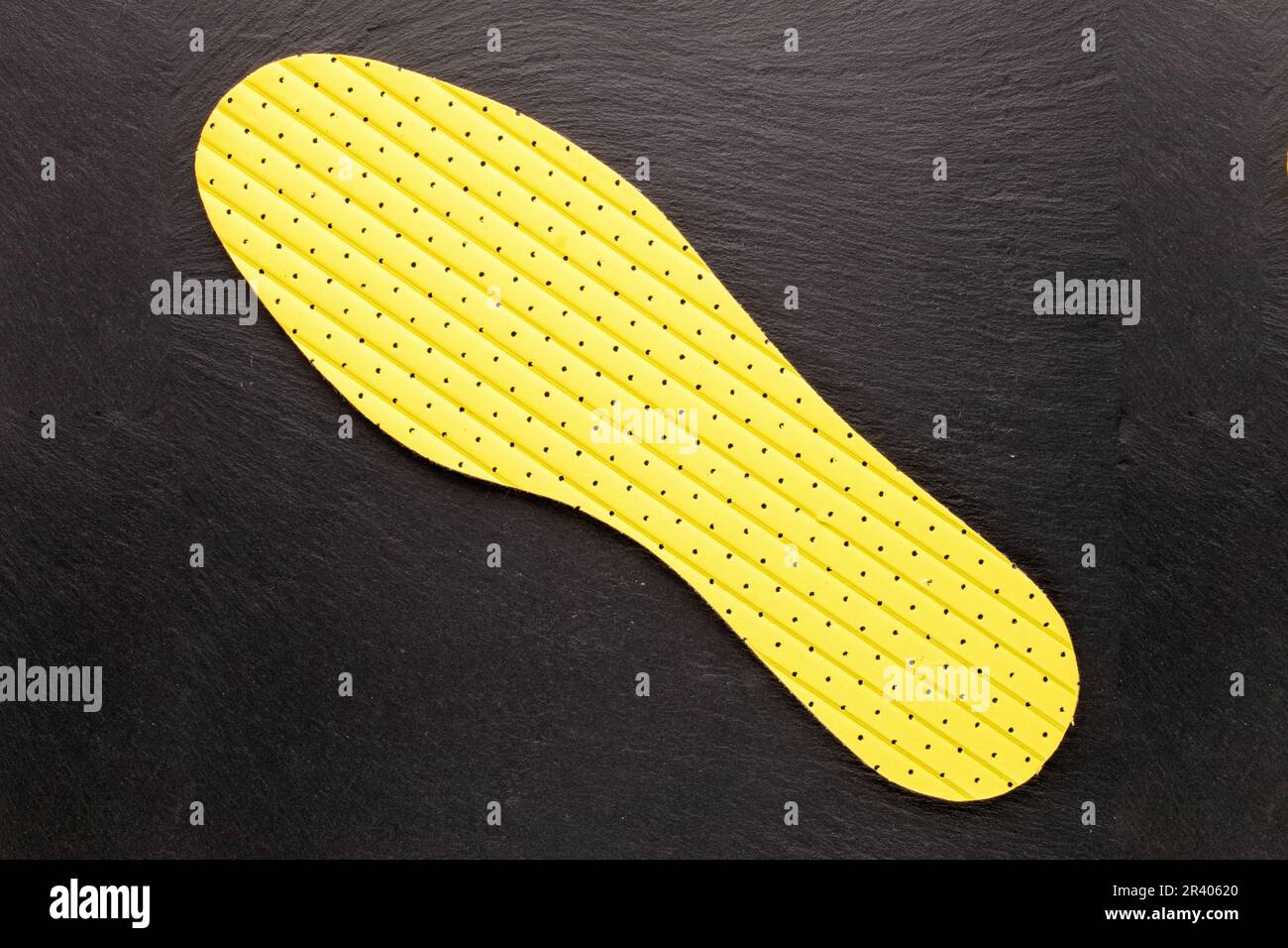 One latex insole on slate stone, top view Stock Photo - Alamy
