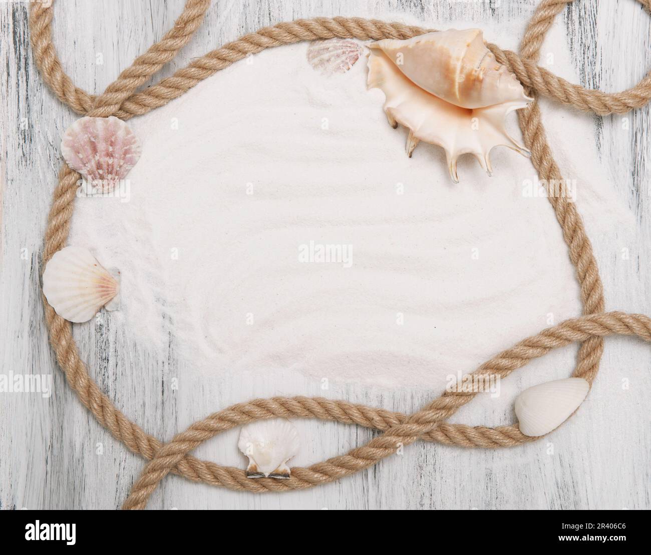 Abstract gray wooden nautical background with starfish, shells and rope ...