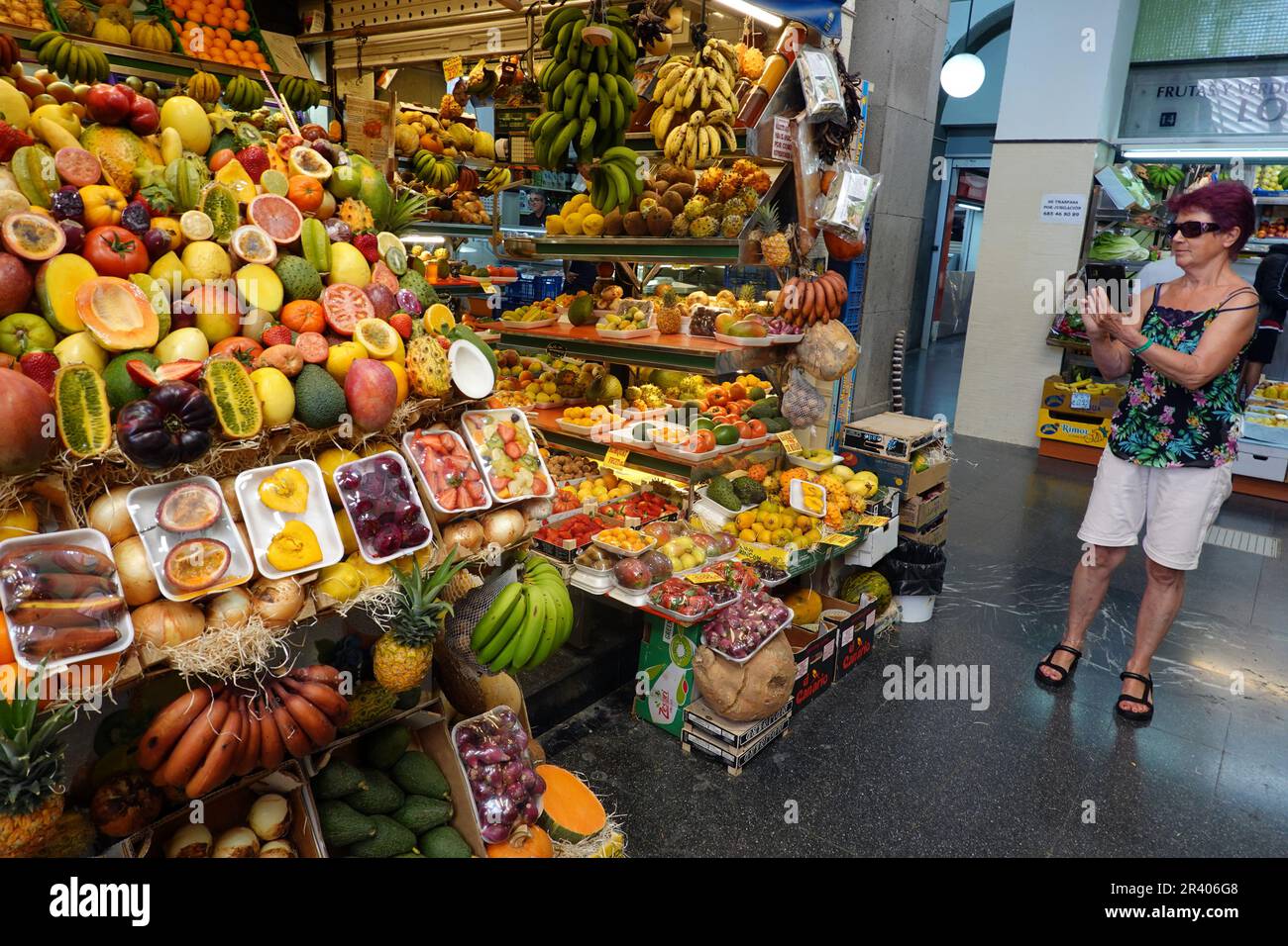 Tourist takes photo of overwhelming fruit and vegetable offer in market ...
