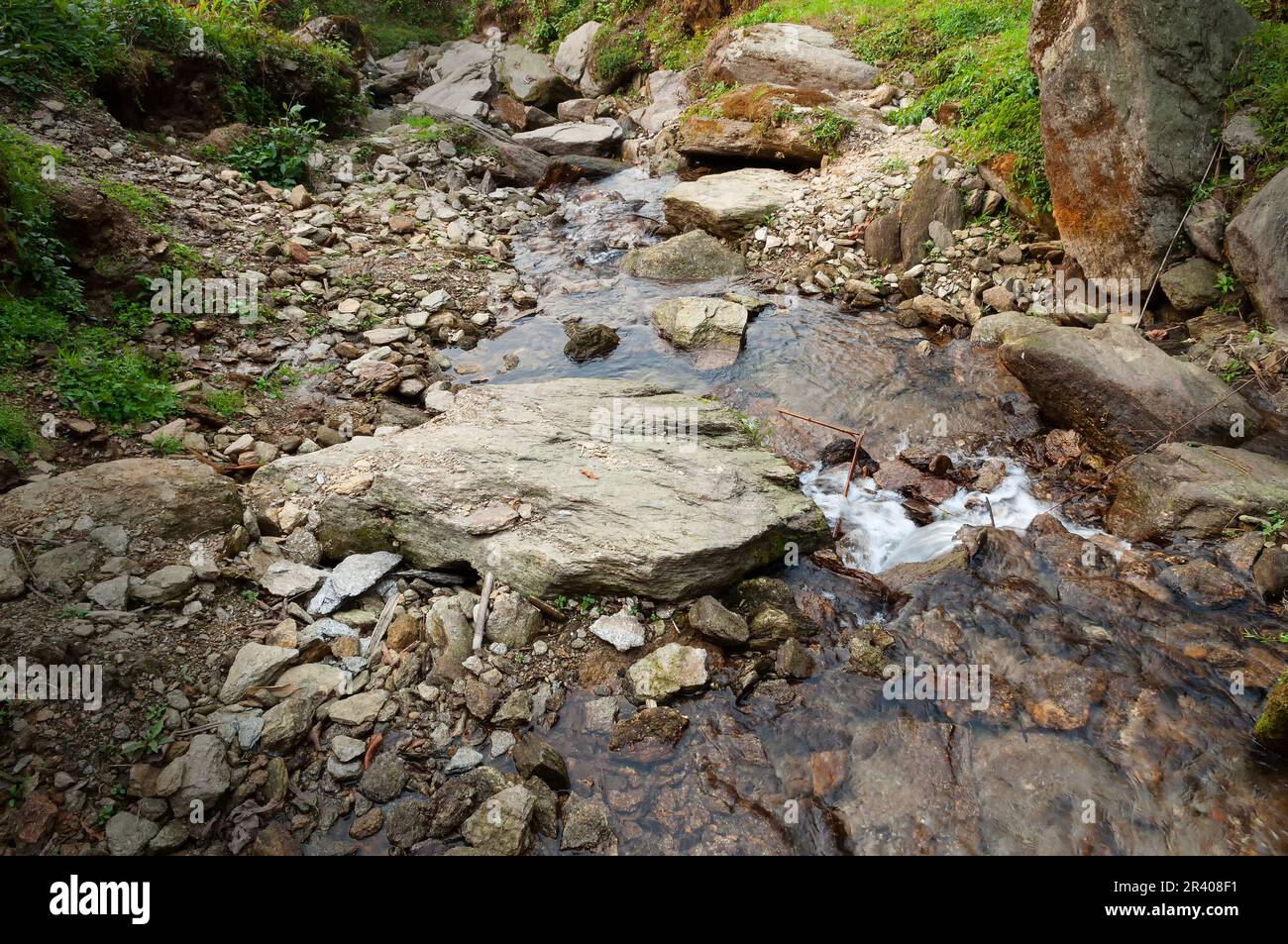 Water flowing through stones,beautiful waterfall inside Himalayan ...