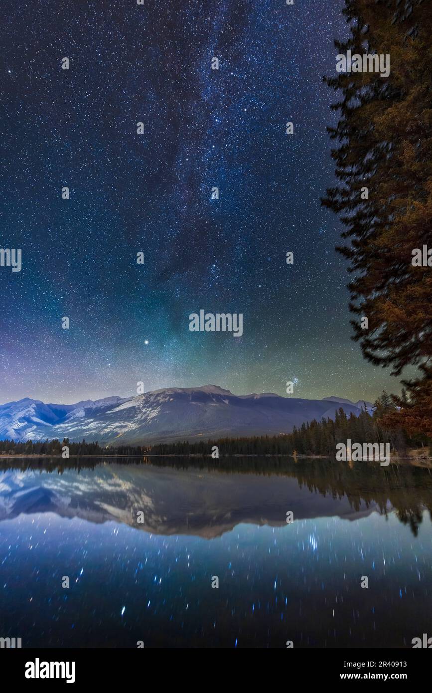 Autumn stars rising over Lake Edith in Jasper National Park, Canada ...