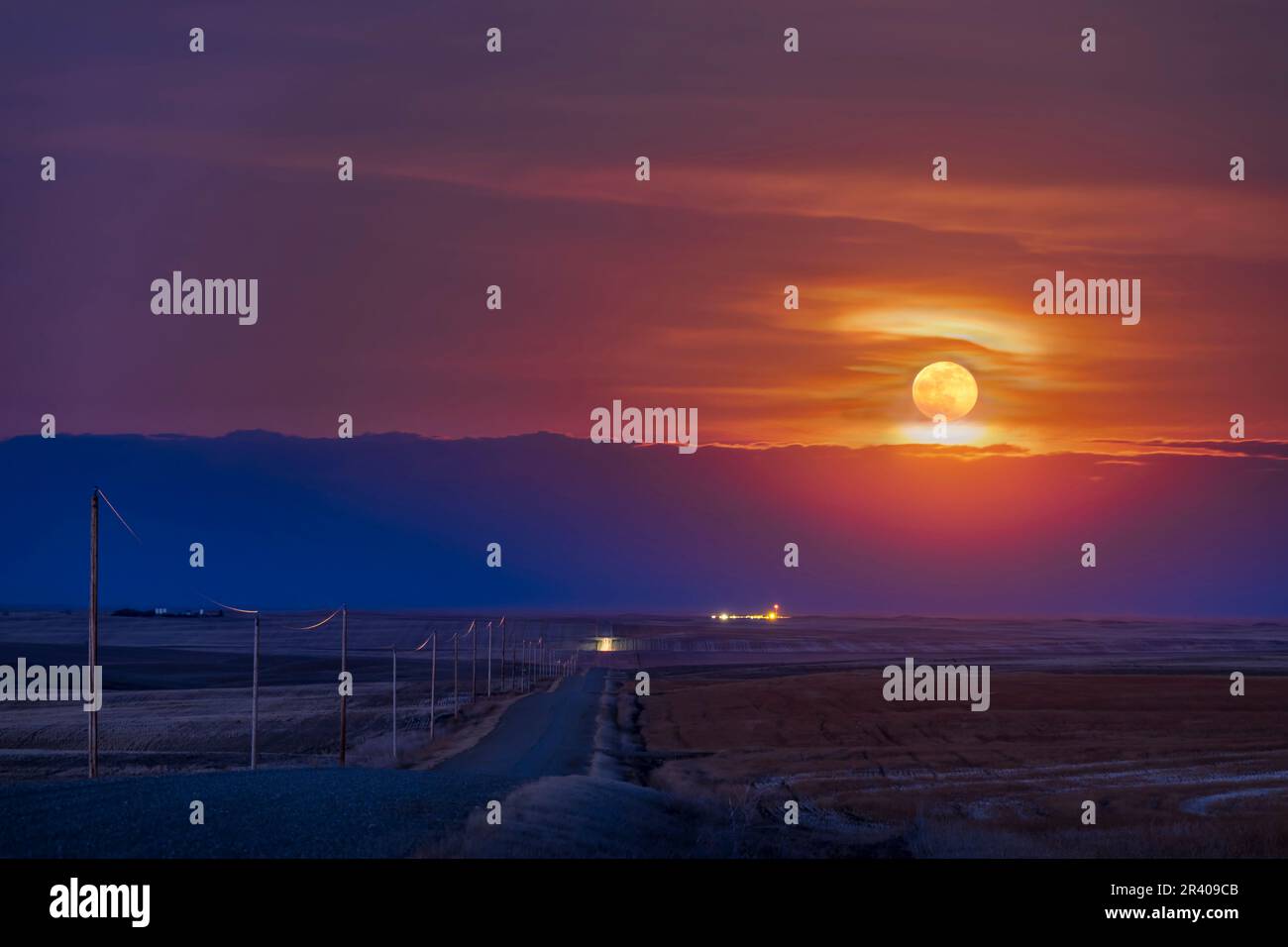Full moon rising over a country road landscape in Alberta, Canda Stock ...