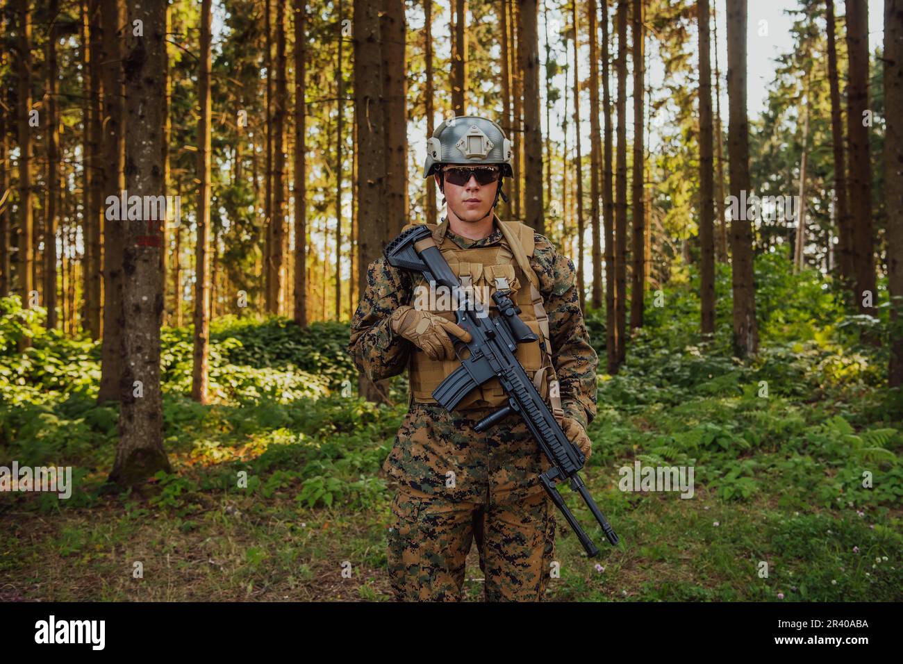 A modern warfare soldier on war duty in dense and dangerous forest ...
