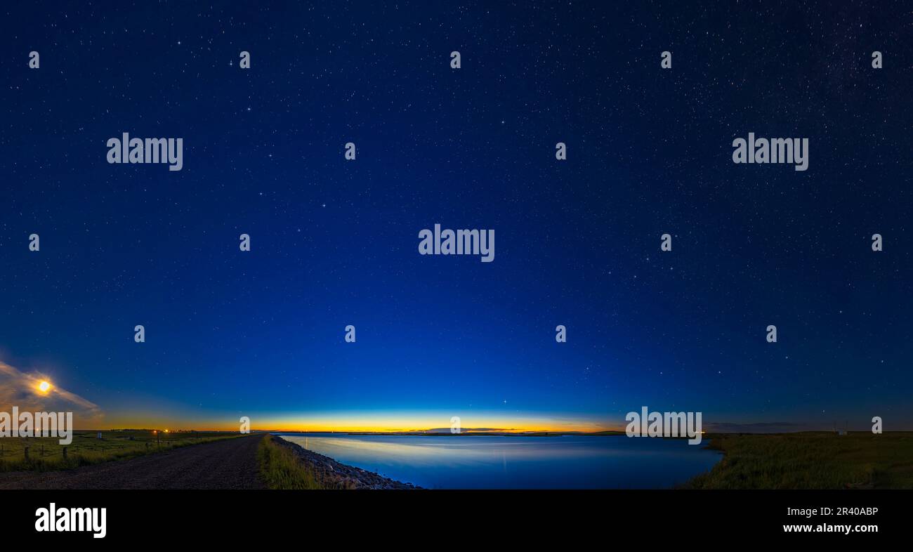A panorama of the northern summer sky in twilight at Crawling Lake in ...
