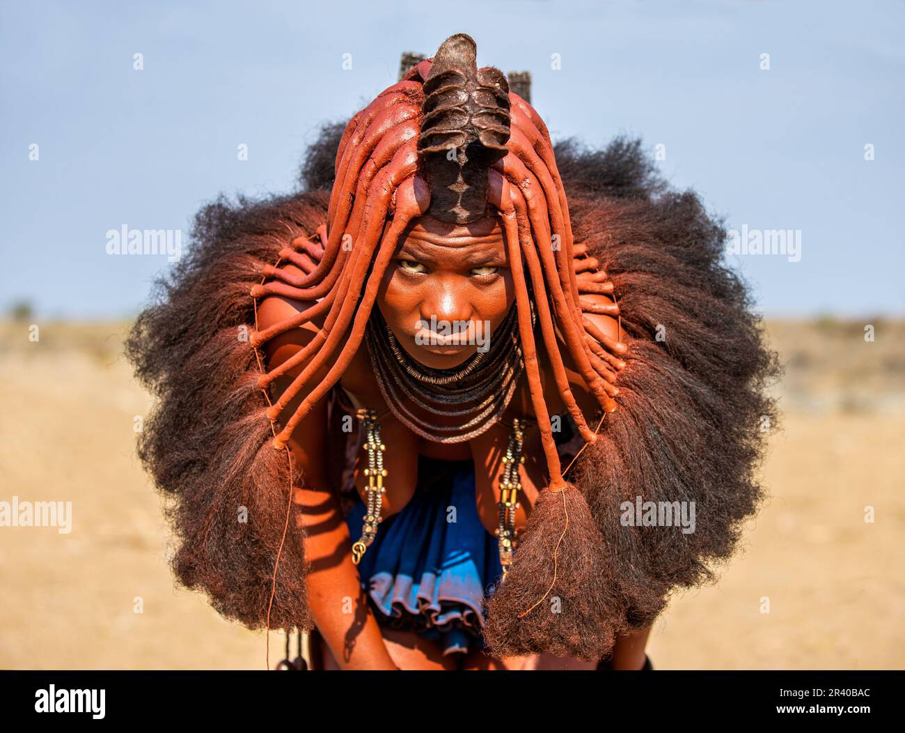 Portrait of a young woman of the Himba tribe with a traditional ...
