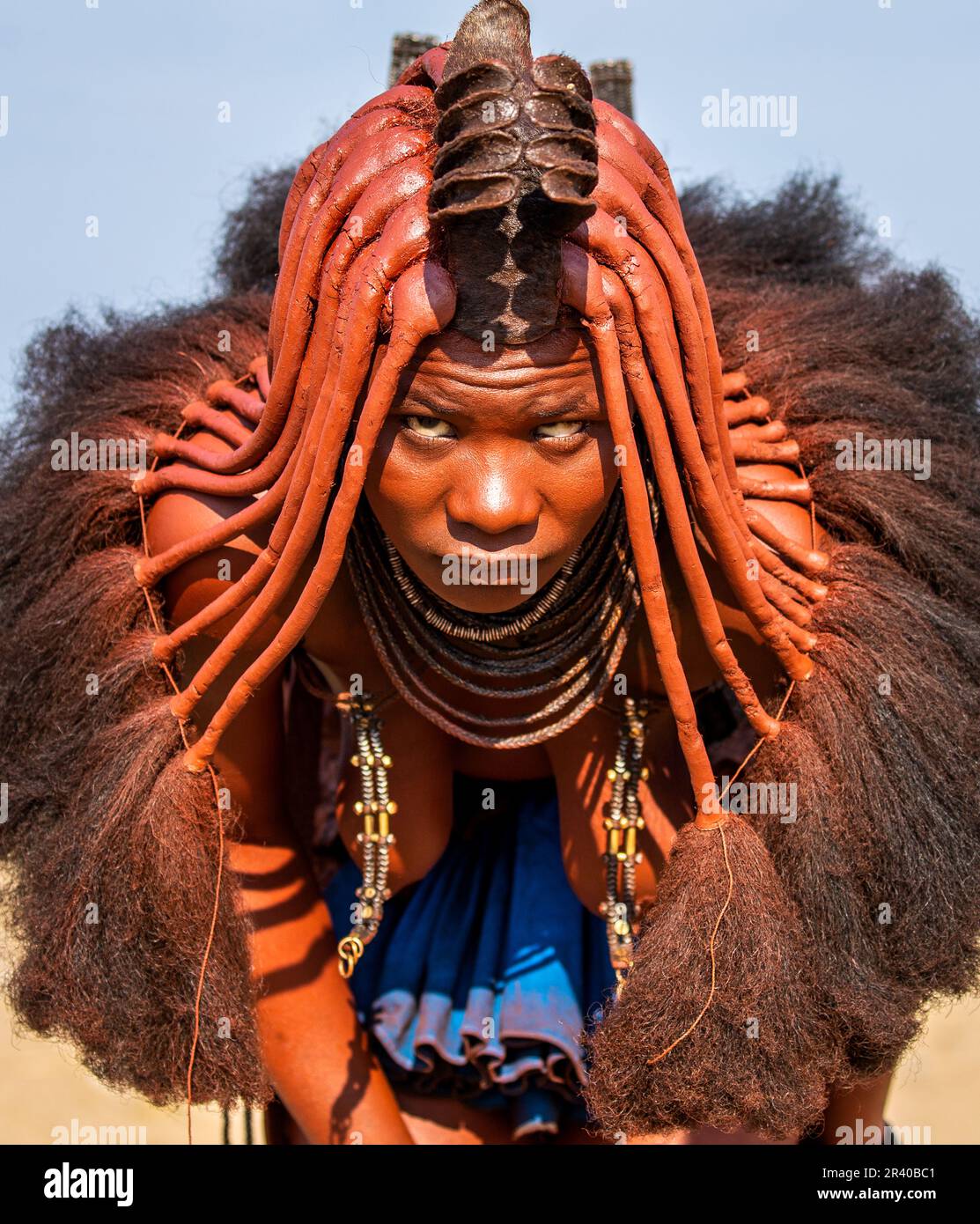 Portrait of a young woman of the Himba tribe with a traditional ...