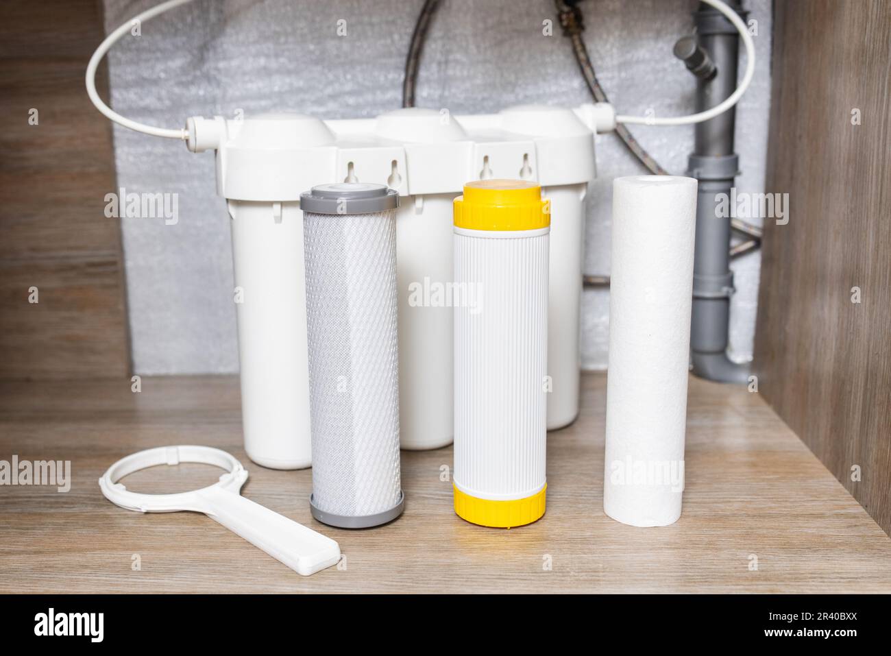 Installation or replacement of water purification filters under kitchen ...