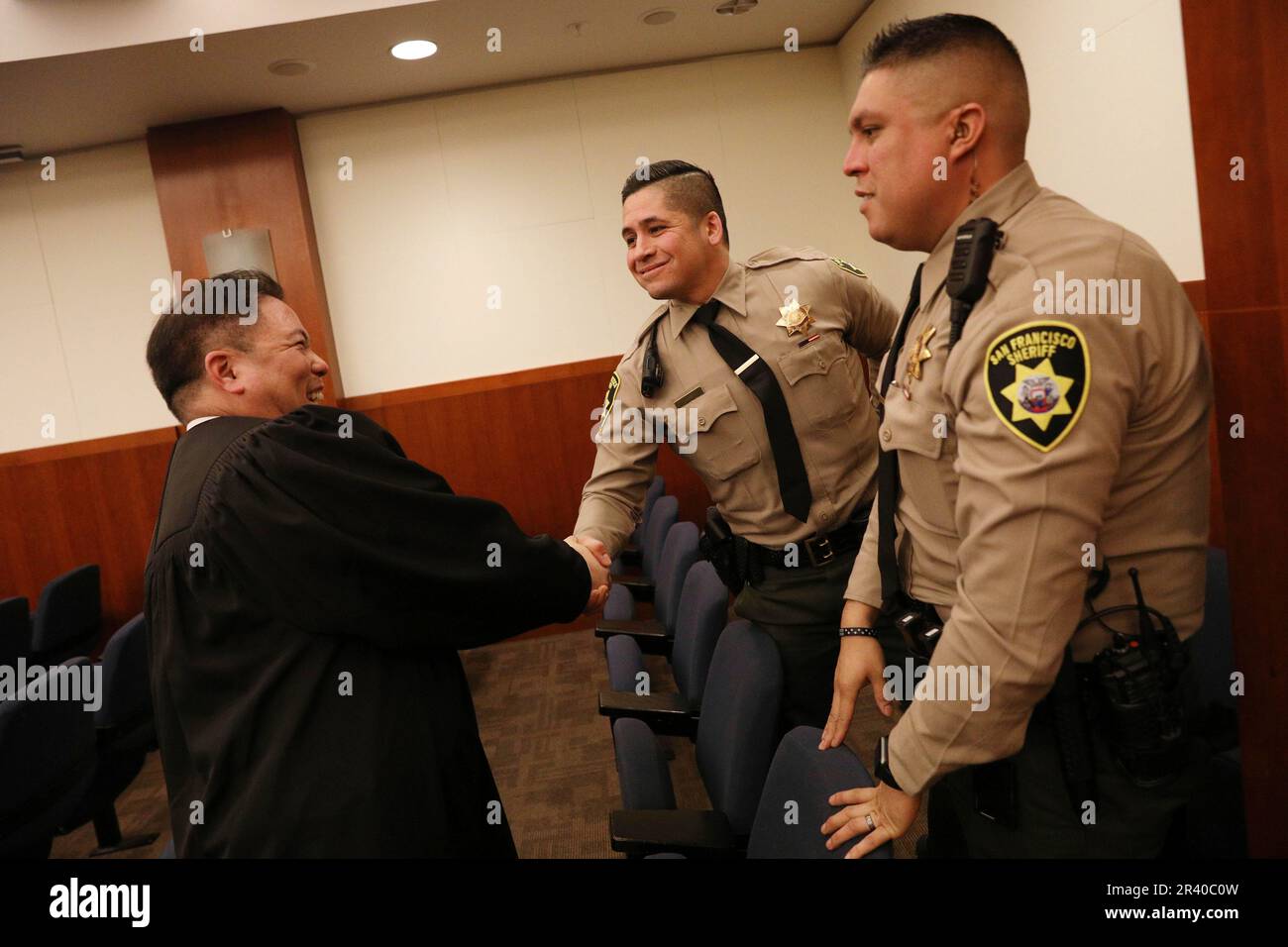 Hon. Roger C. Chan (left) greets Deputy Avinadar Jaime (center) and ...