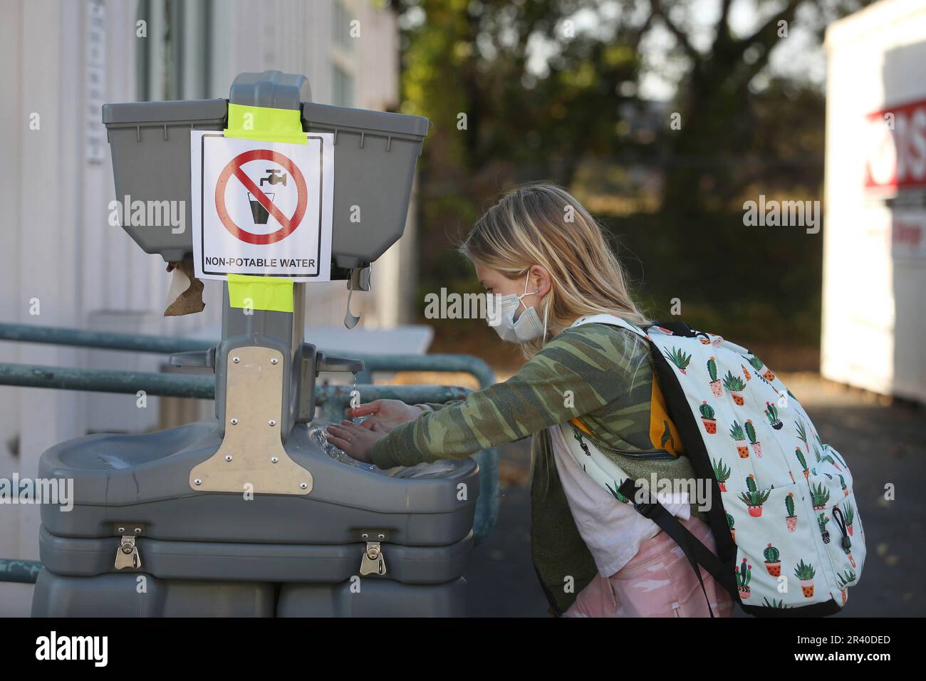 Bel Aire Elementary School fourth grader Simone, 9, washes her hands at ...