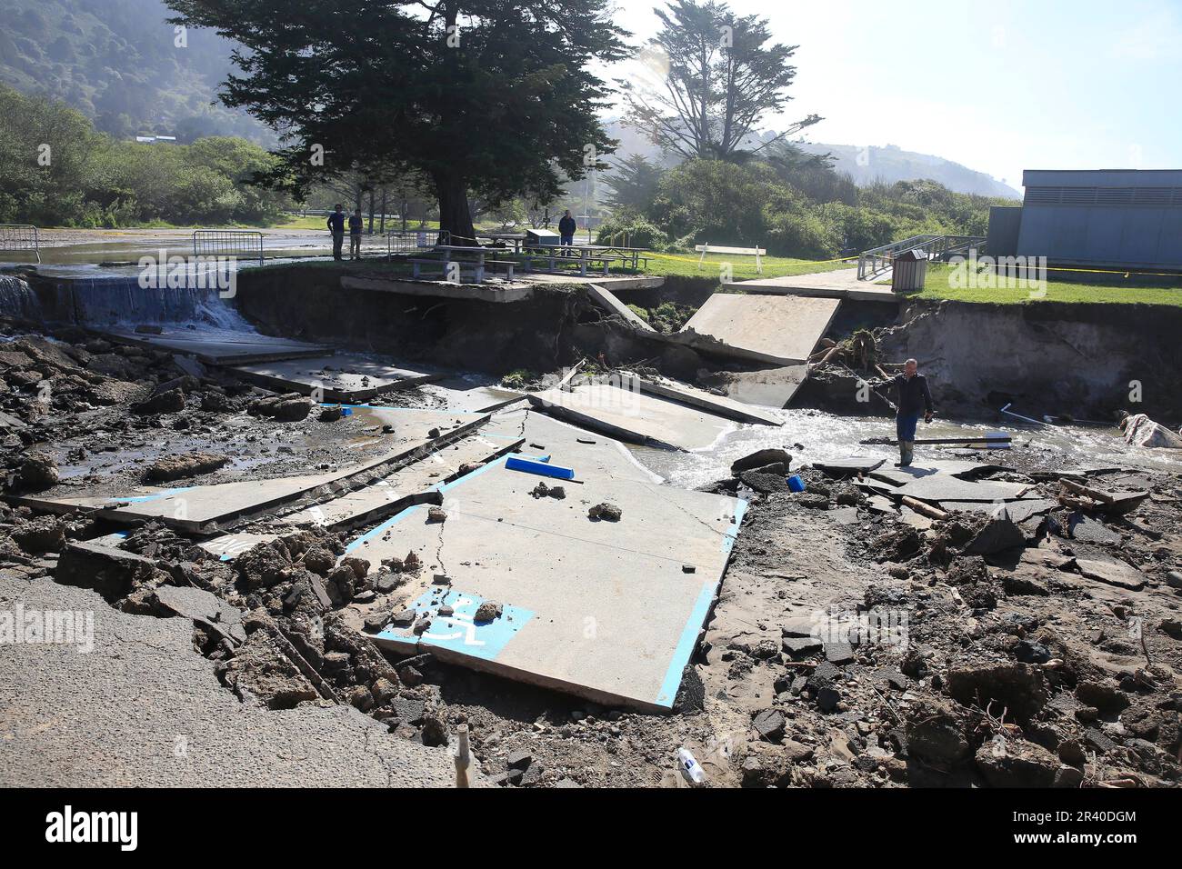 Dino Colombo (right) of Stinson Beach stands on debris from where part ...