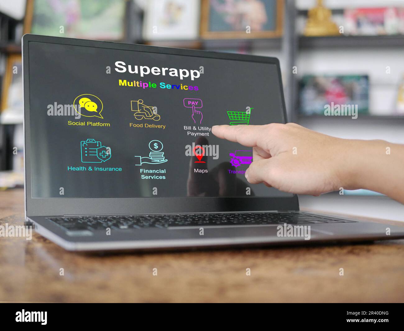 Finger about to tap on a screen of superapp on computer notebook or ...