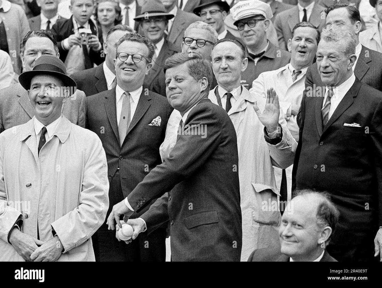 FILE - President John F. Kennedy winds up to throw out the first pitch ...
