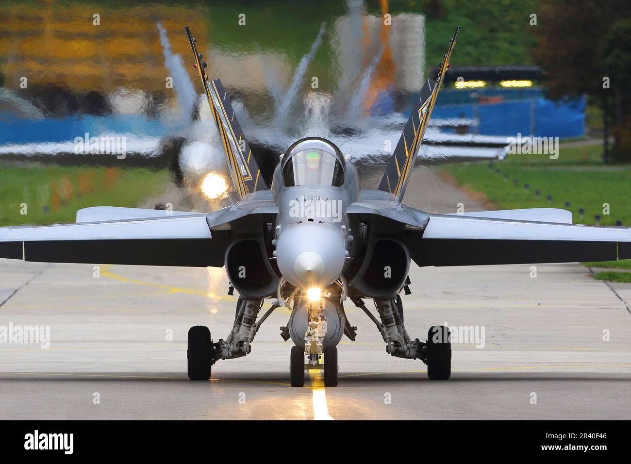 F/A-18C Hornet jet fighters of the Swiss Air Force taxiing on runway in ...
