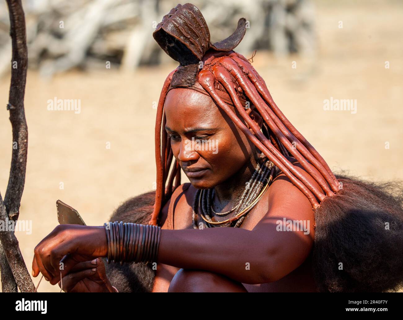 Portrait of a Himba tribe woman with a mirror Stock Photo - Alamy