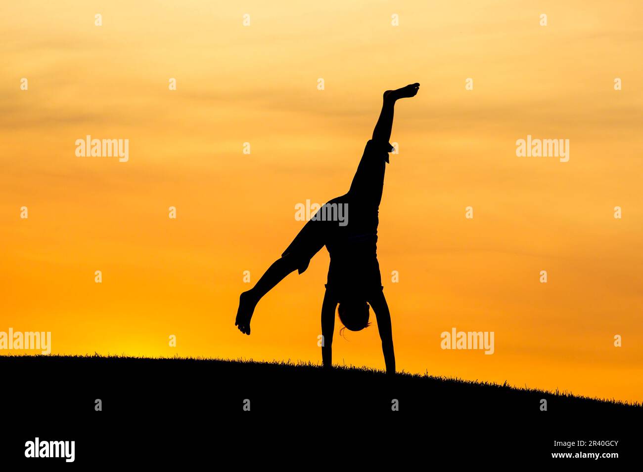 Child cartwheel hi-res stock photography and images - Alamy