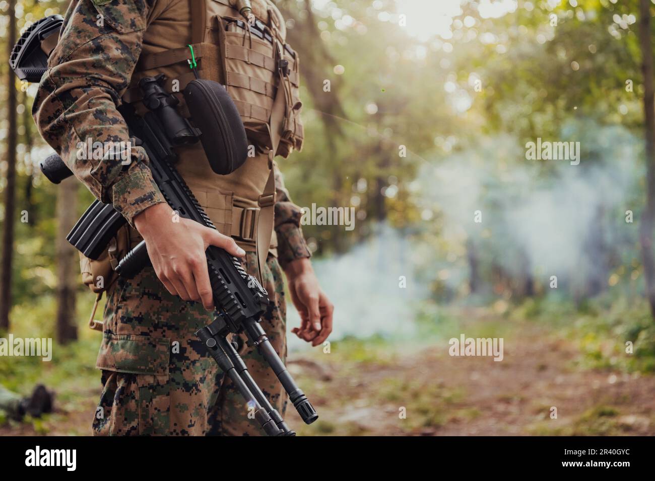 Soldier portrait with protective army tactical gear and weapon having a ...