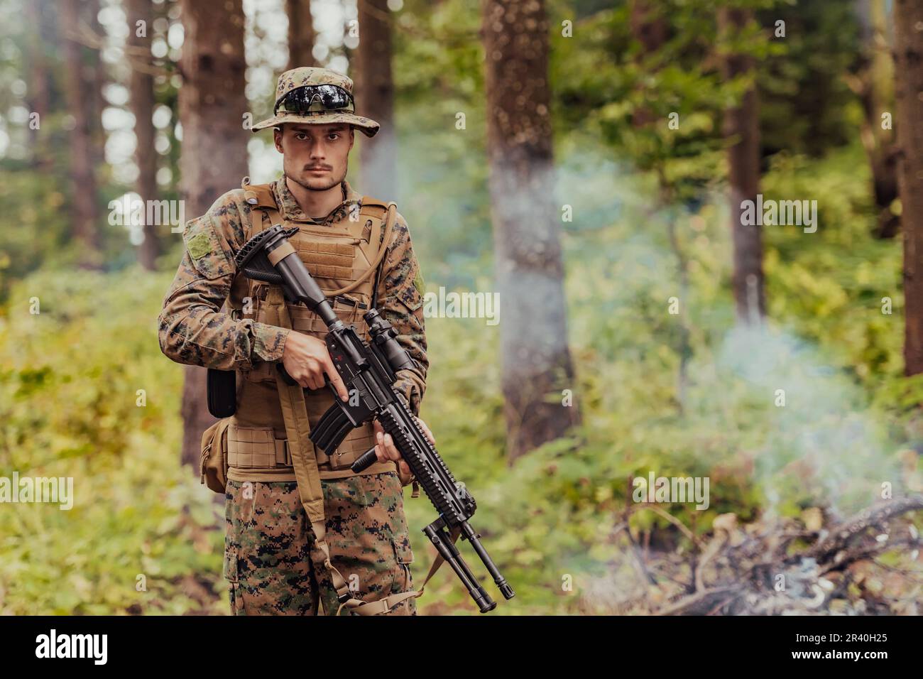 A modern warfare soldier on war duty in dense and dangerous forest ...