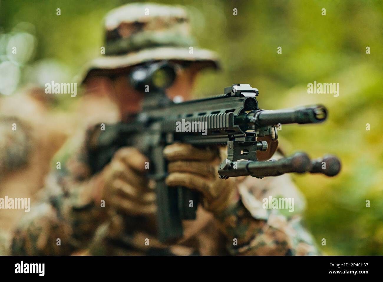 A modern warfare soldier on war duty in dense and dangerous forest ...