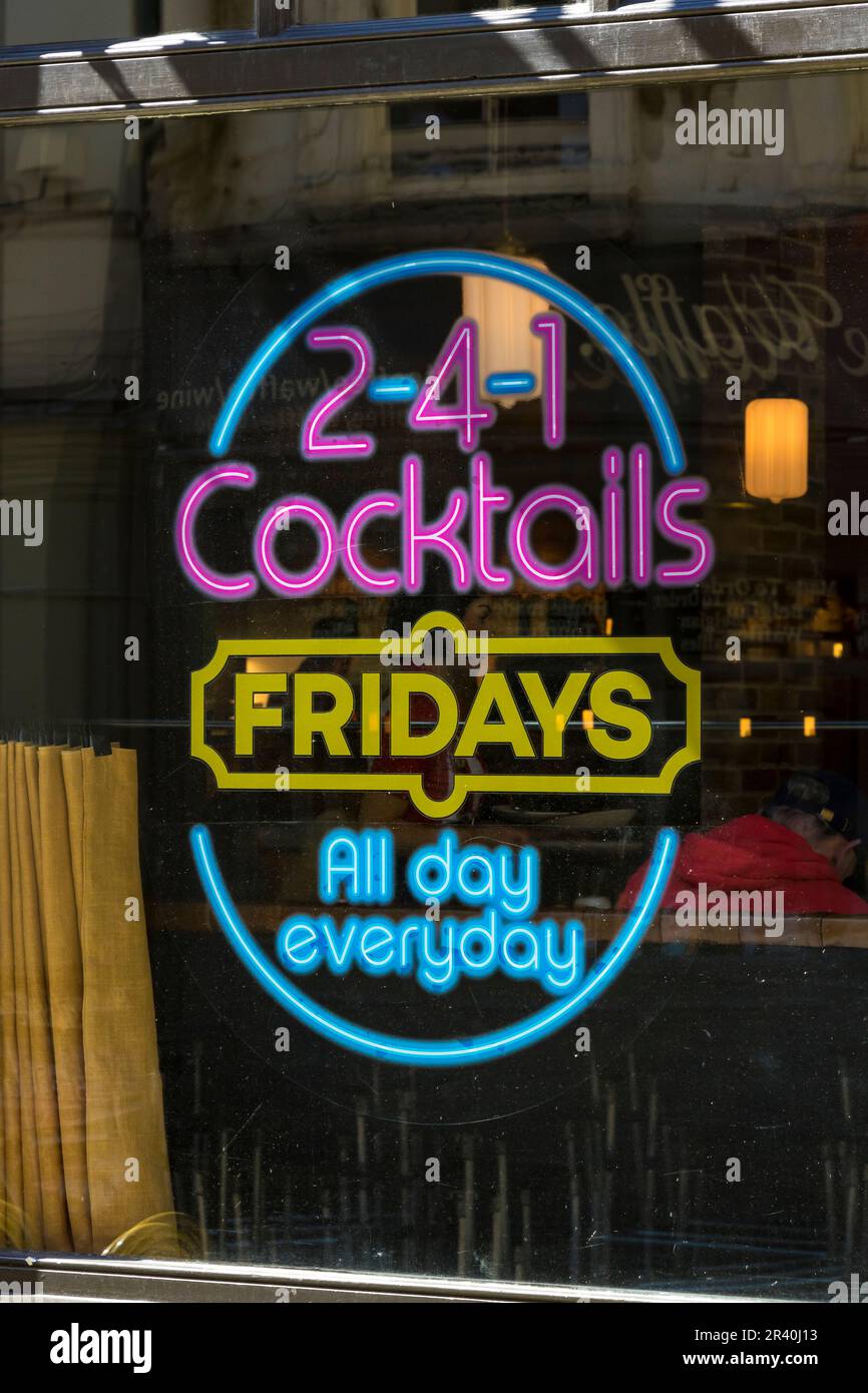Illuminated sign on Fridays pub window advertising two for one ...