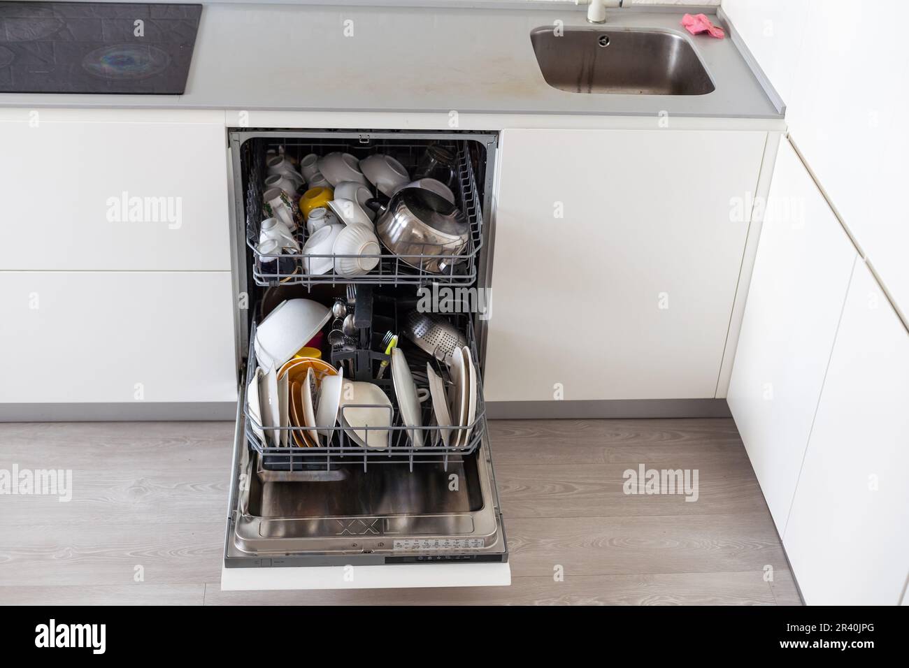 Open dishwasher with clean dishes in the white kitchen Stock Photo - Alamy