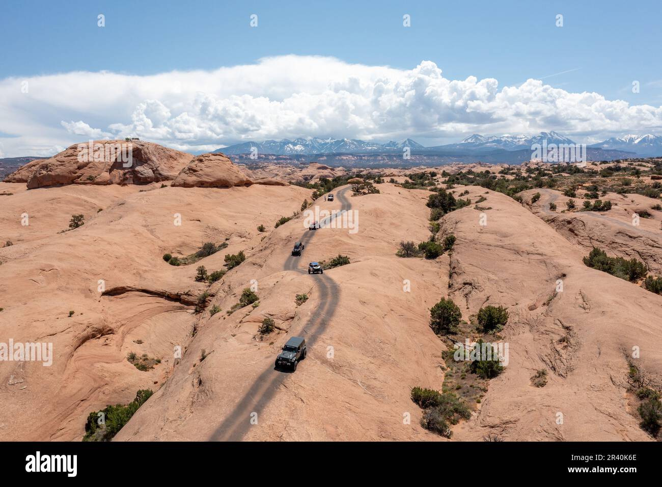 A Jeep & Off Highway Vehicles or OHVs travel over the sandstone domes ...