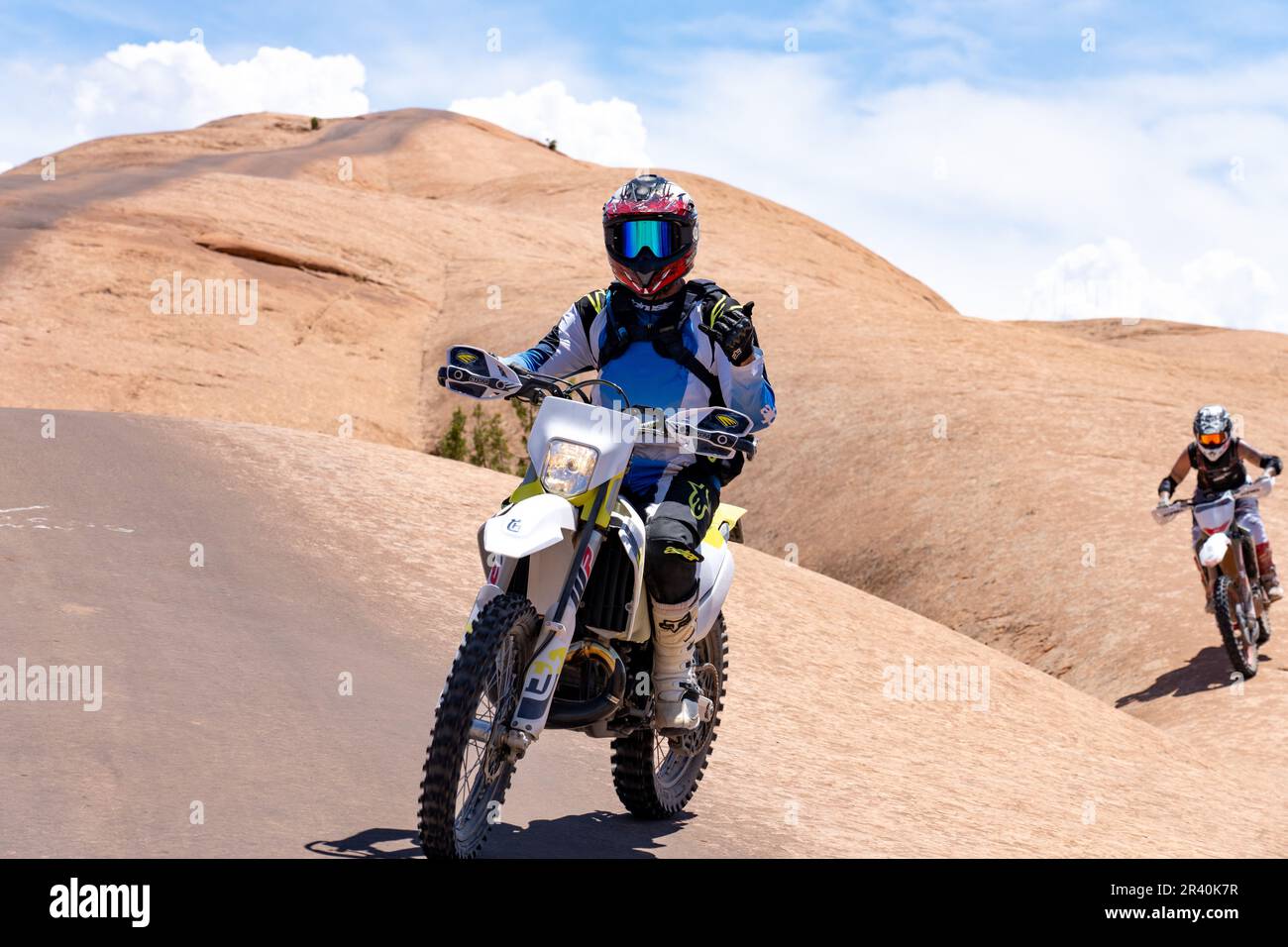 Off road motorcycles riding over the sandstone domes of the Fins ...