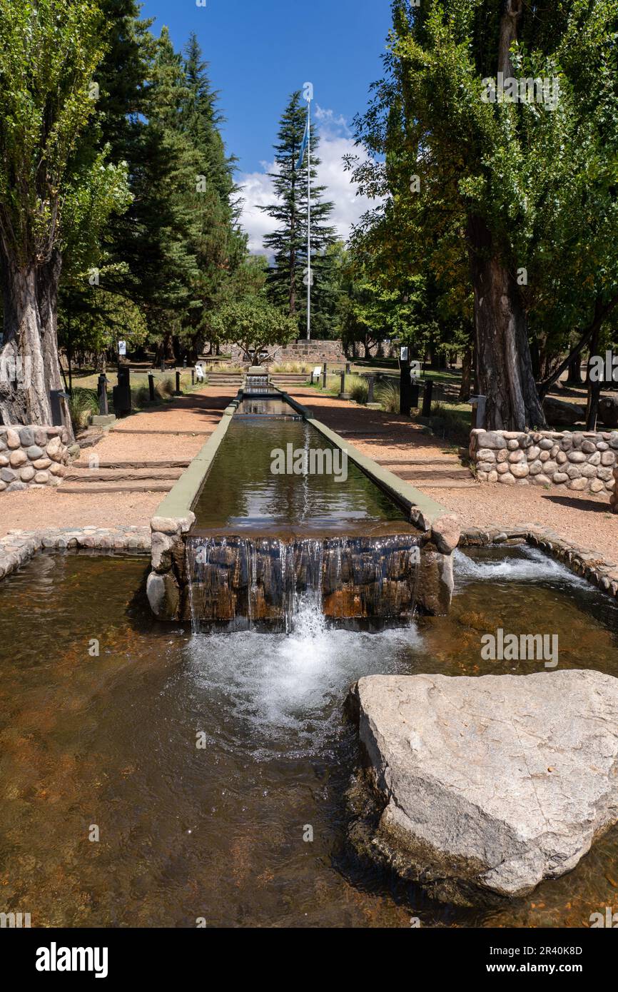 A water feature & the historic apple tree at the Manzano Historico park ...
