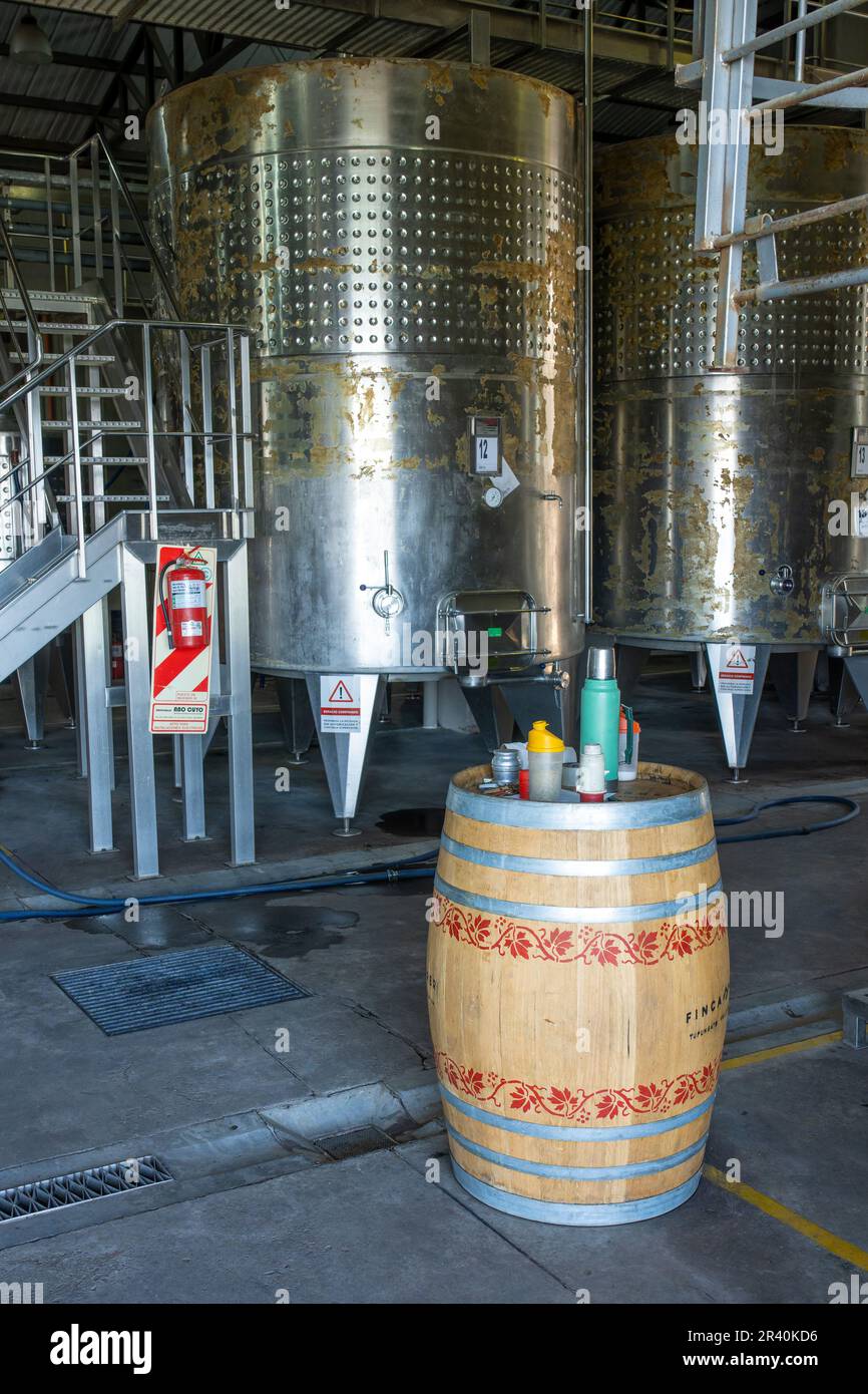 An oak wine barrel & stainless steel fermentation vats at the Ferrer ...