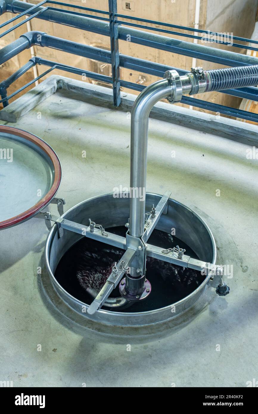 Wine is pumped back into a wine vat to circulate in the Los Cuadros ...