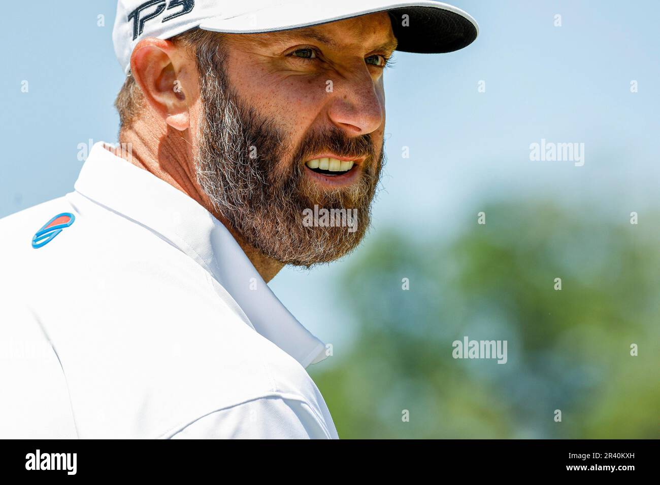 Captain Dustin Johnson of 4Aces GC looks on from the driving range ...
