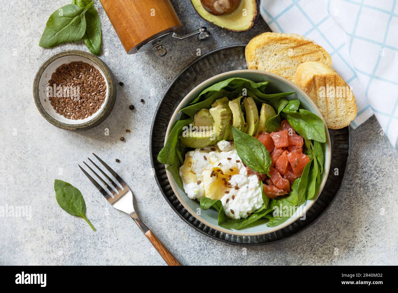 Classic breakfast, brunch - with poached egg, avocado, arugula, flax ...