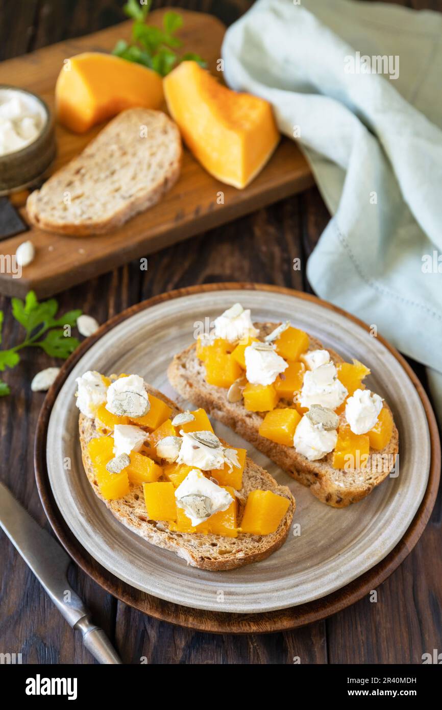 Healthy food, vegetarian appetizer on a rustic table. Open sandwiches ...