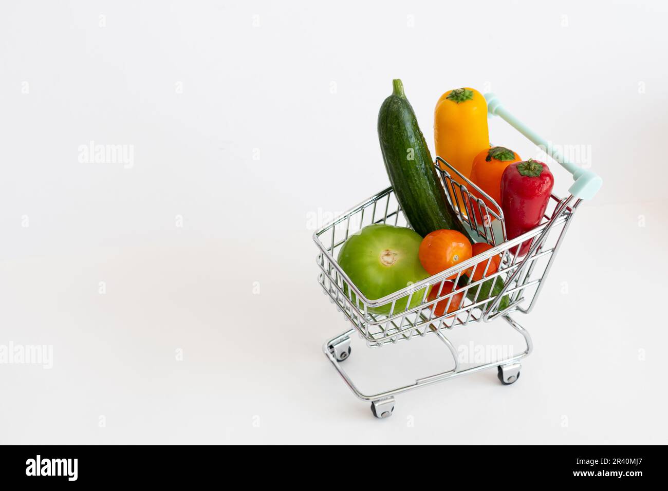 Shopping cart full of vegetables. Vegan food, healthy diet. White ...